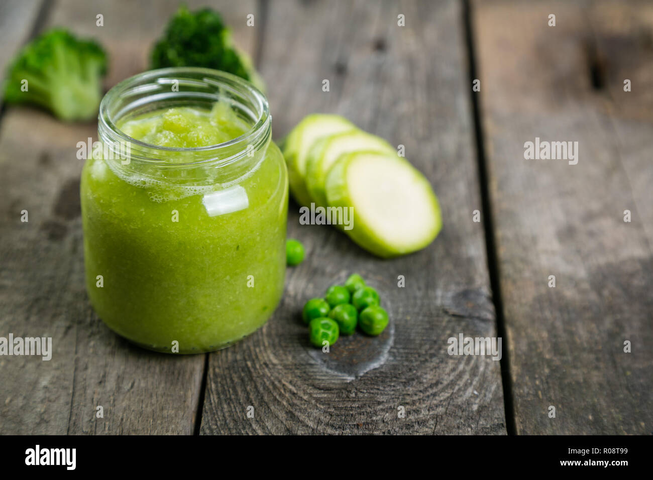 Green baby food purees in glass jars with ingredients. Healthy organic ...
