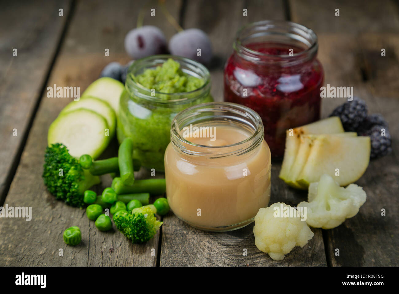 Colorful baby food purees in glass jars with ingredients. Healthy ...