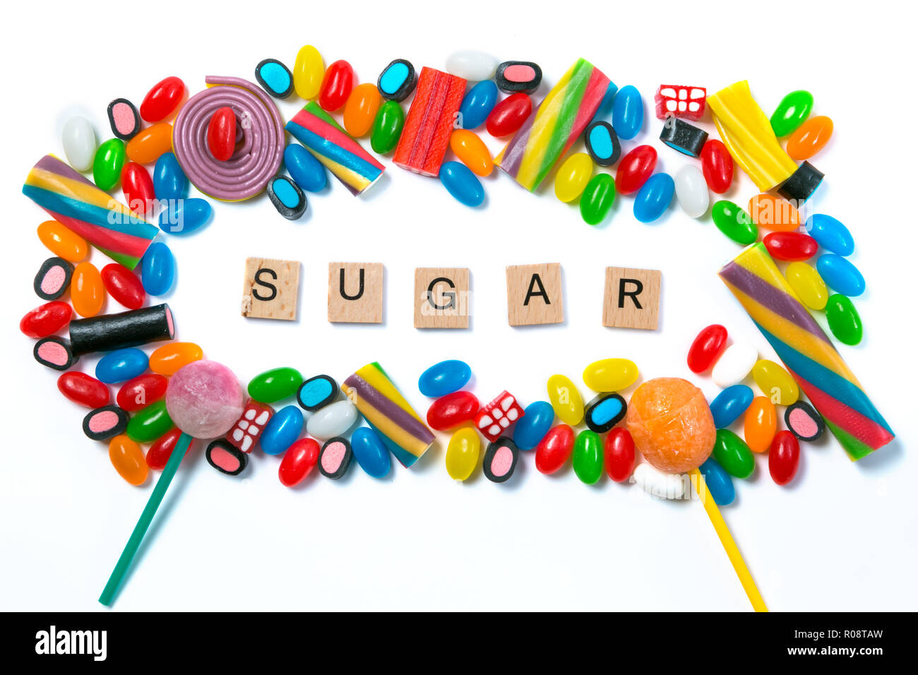 Diabetes concept - selection of candy on white background, sugar ...