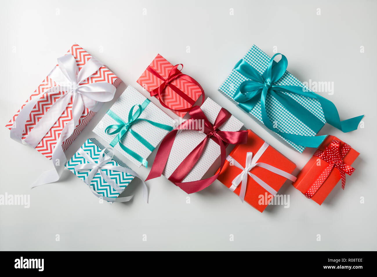 Christmas concept - colorful presents on white background Stock Photo ...