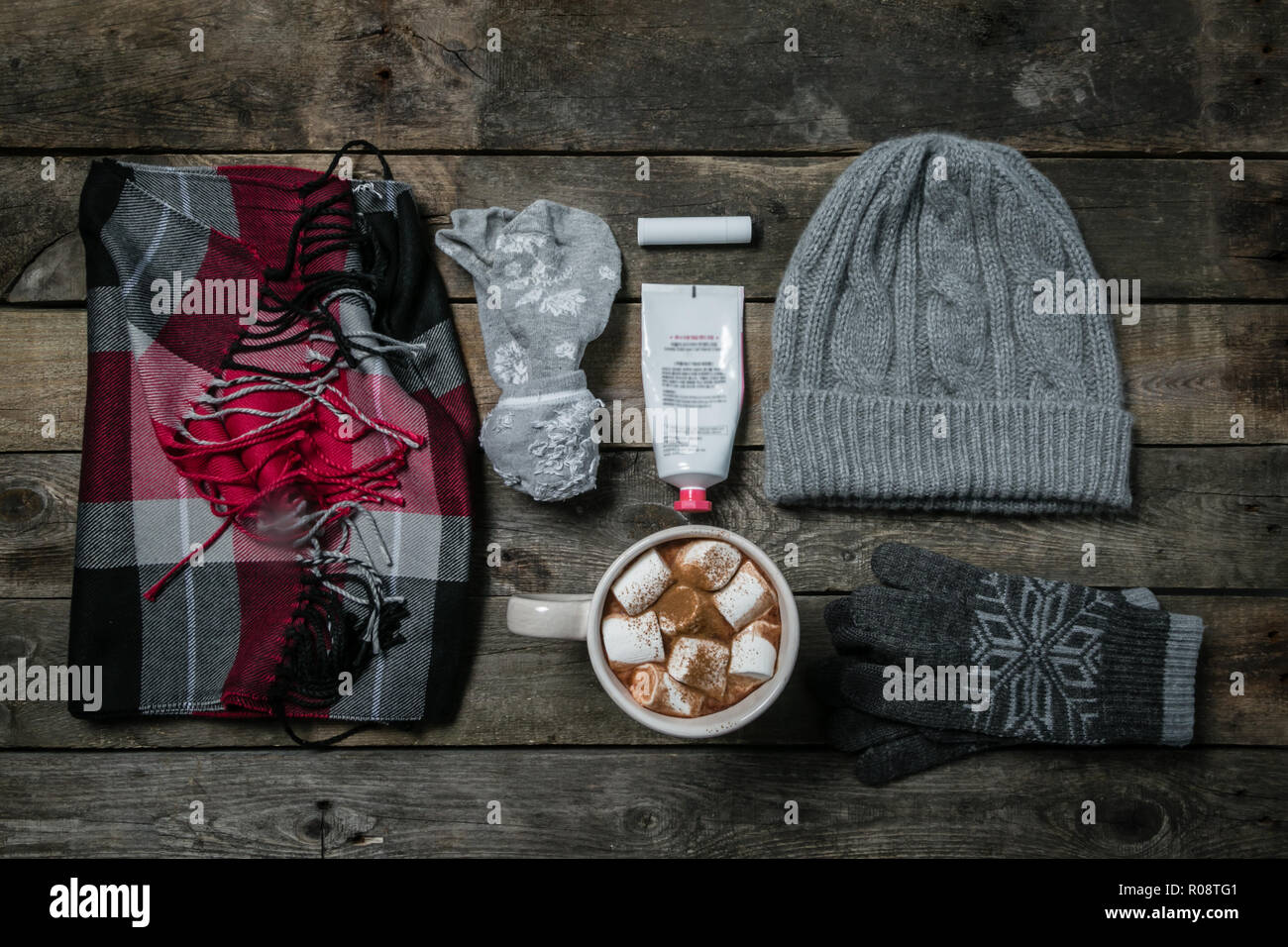 Selection of essentials for cold winter weather - hat. scarf, gloves ...