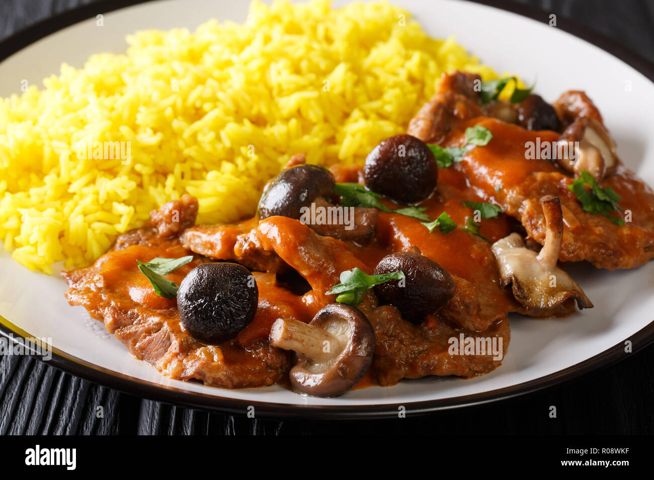 Spanish slow stewed beef fricando with gravy and mushrooms served with ...