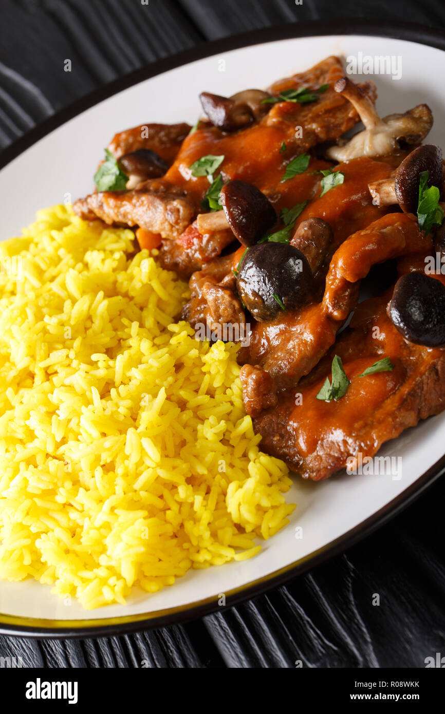 Catalan fricando beef with gravy and wild mushrooms served with yellow ...