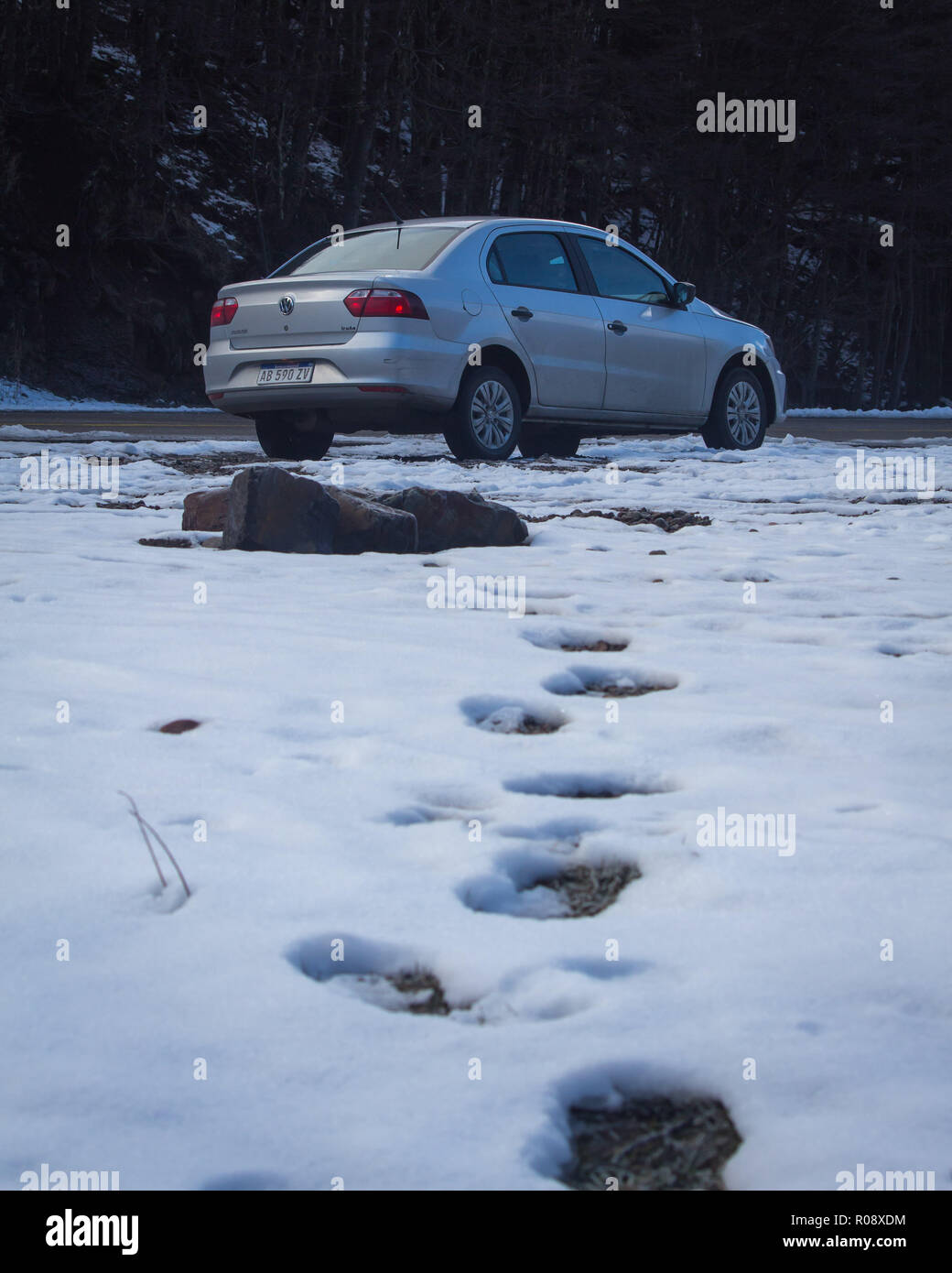 footprints on snow all the way to the car Stock Photo - Alamy