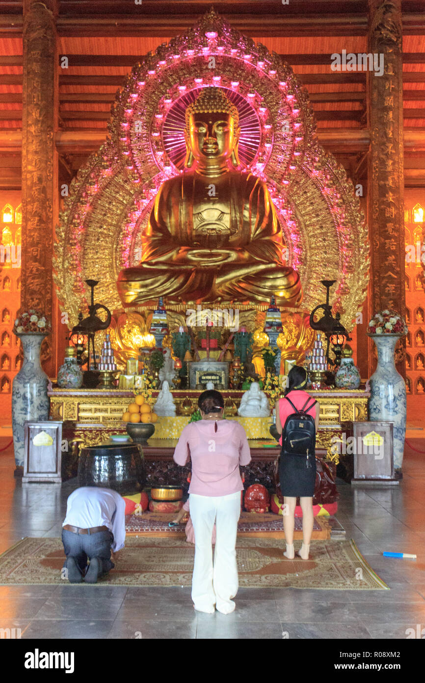 inside of a golden buddhist temple, vietnam Stock Photo - Alamy
