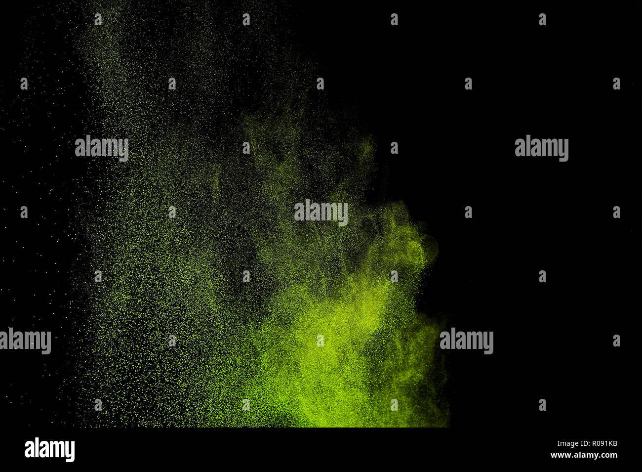 Abstract green paint Holi. Abstract green powder explosion on black ...