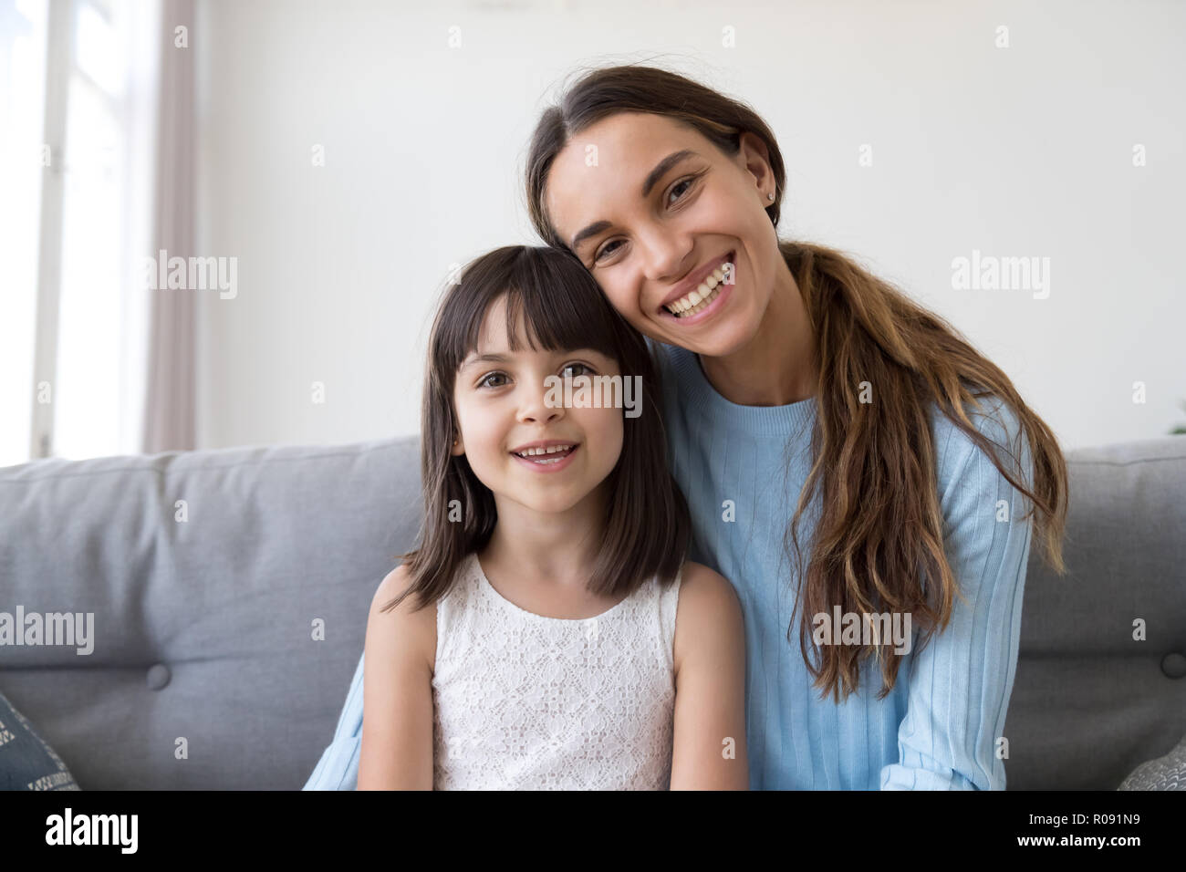Daughter and mother have video call smiling looking at camera Stock ...