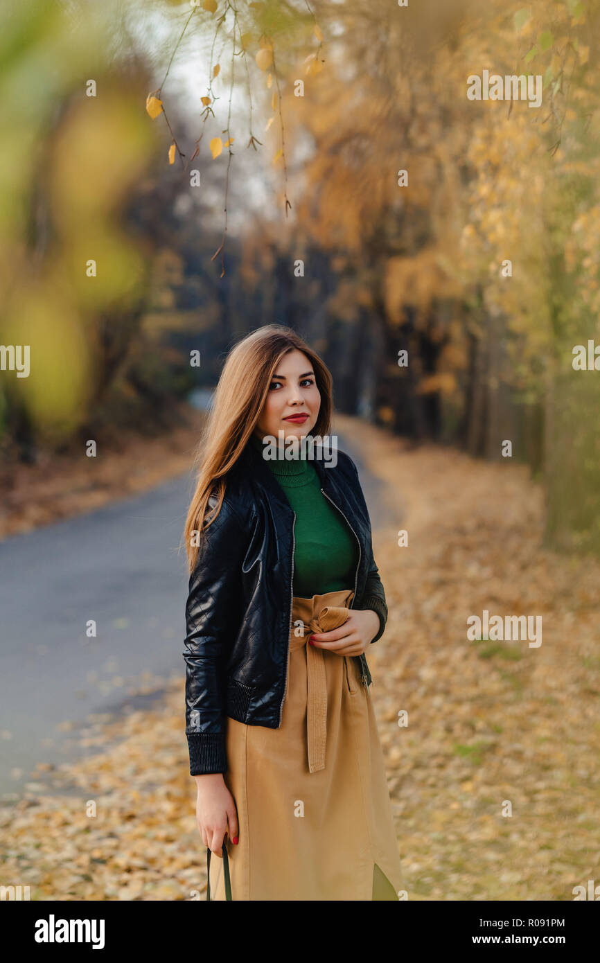 cozy stylish young girl walk at autumn colorful park alone Stock Photo ...