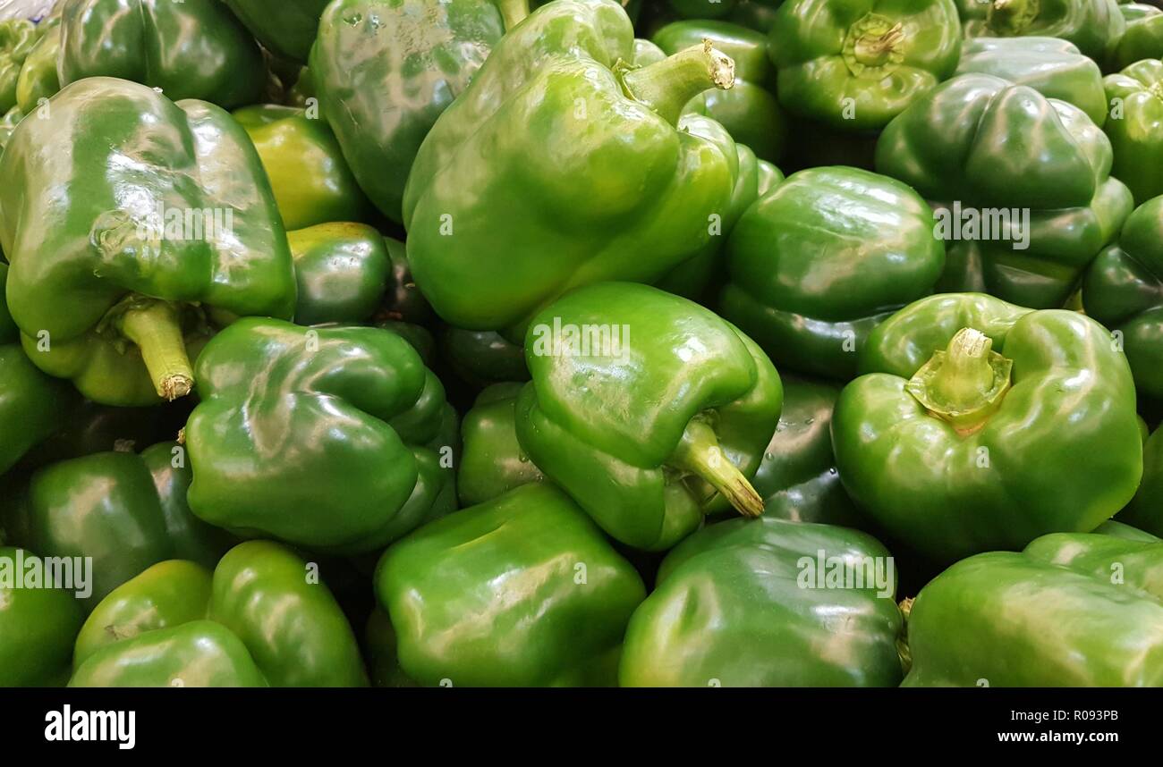 Fresh green Bell Pepper vegetables on a market stand Stock Photo - Alamy