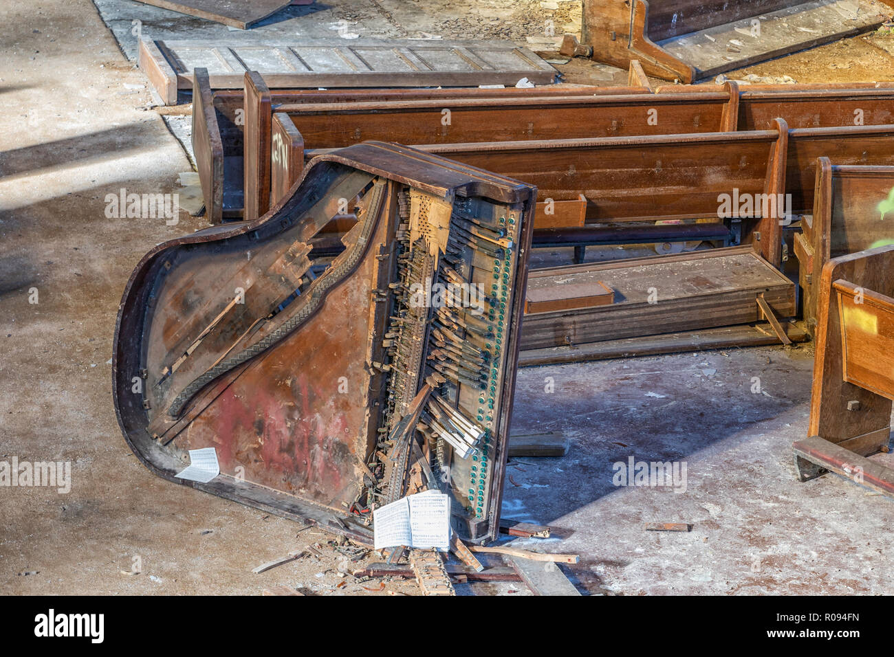 A destroyed grand piano in an abandoned church Stock Photo - Alamy