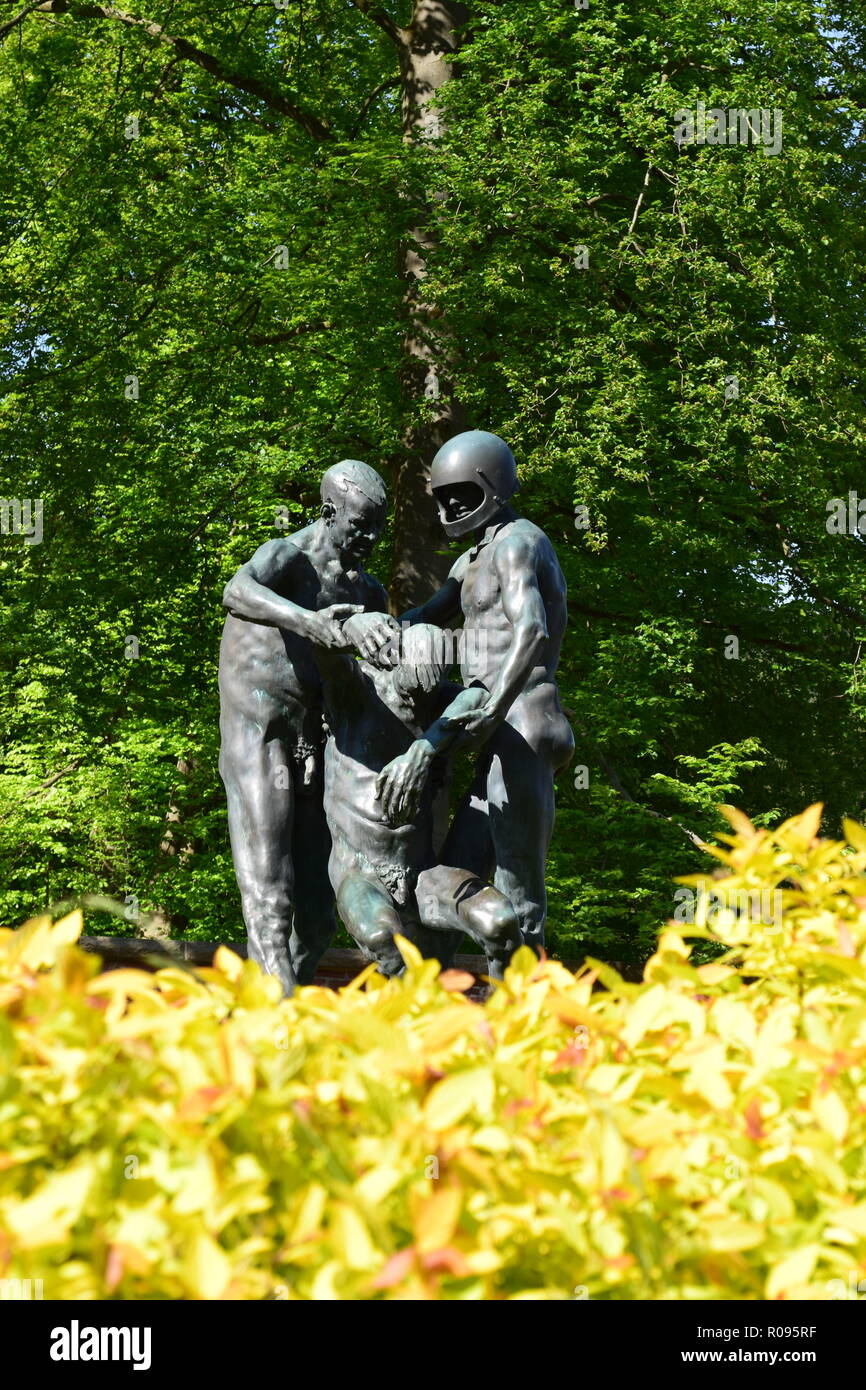 A bronze statue in the War War 2 military Cemetery in Reimsbach depicts ...