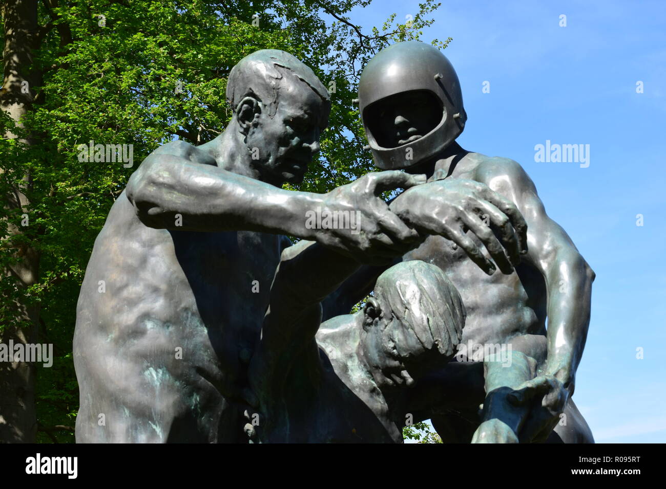 A bronze statue in the War War 2 military Cemetery in Reimsbach depicts ...