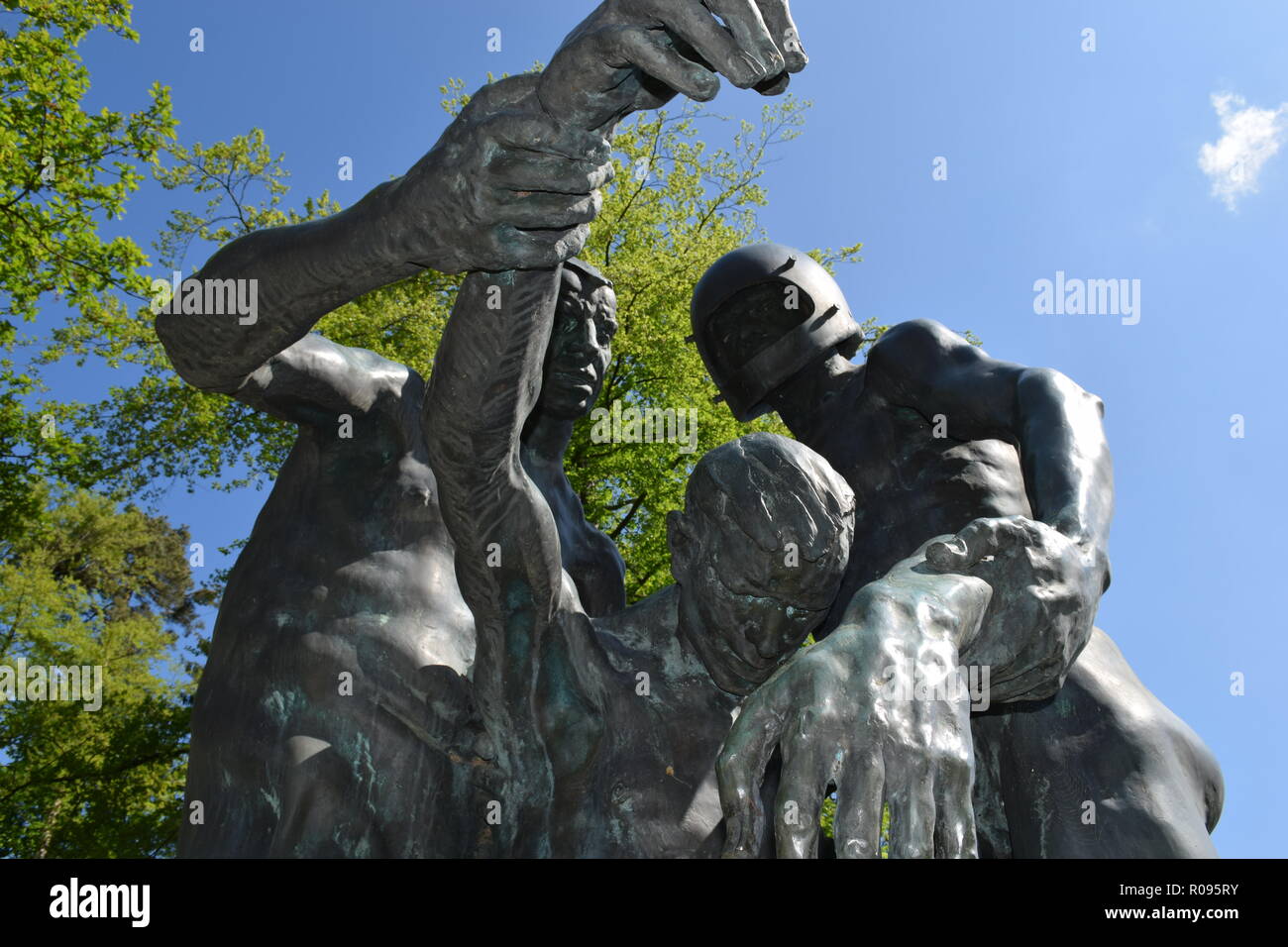 A bronze statue in the War War 2 military Cemetery in Reimsbach depicts ...