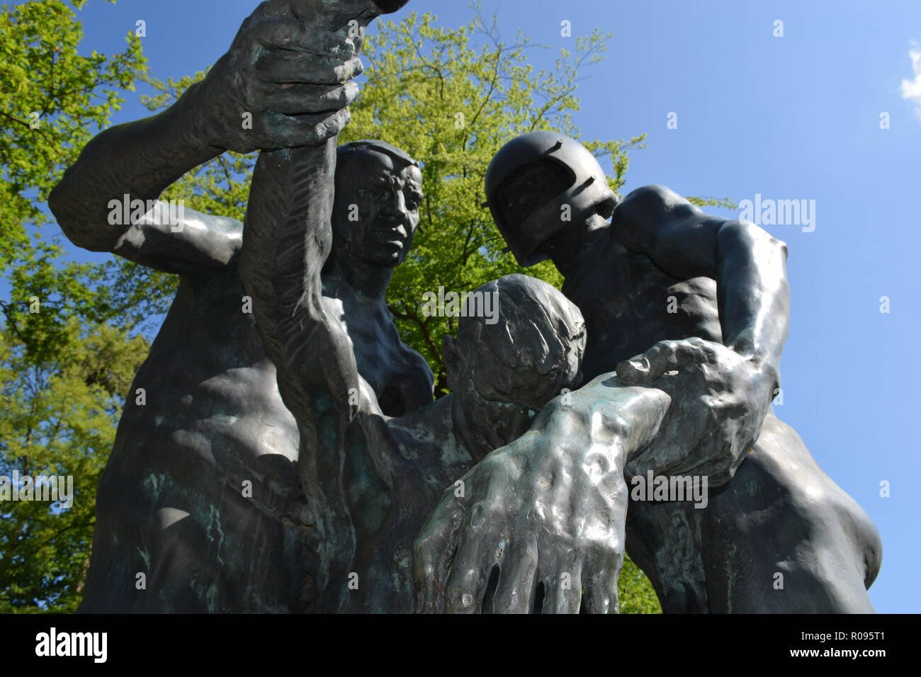 A bronze statue in the War War 2 military Cemetery in Reimsbach depicts ...