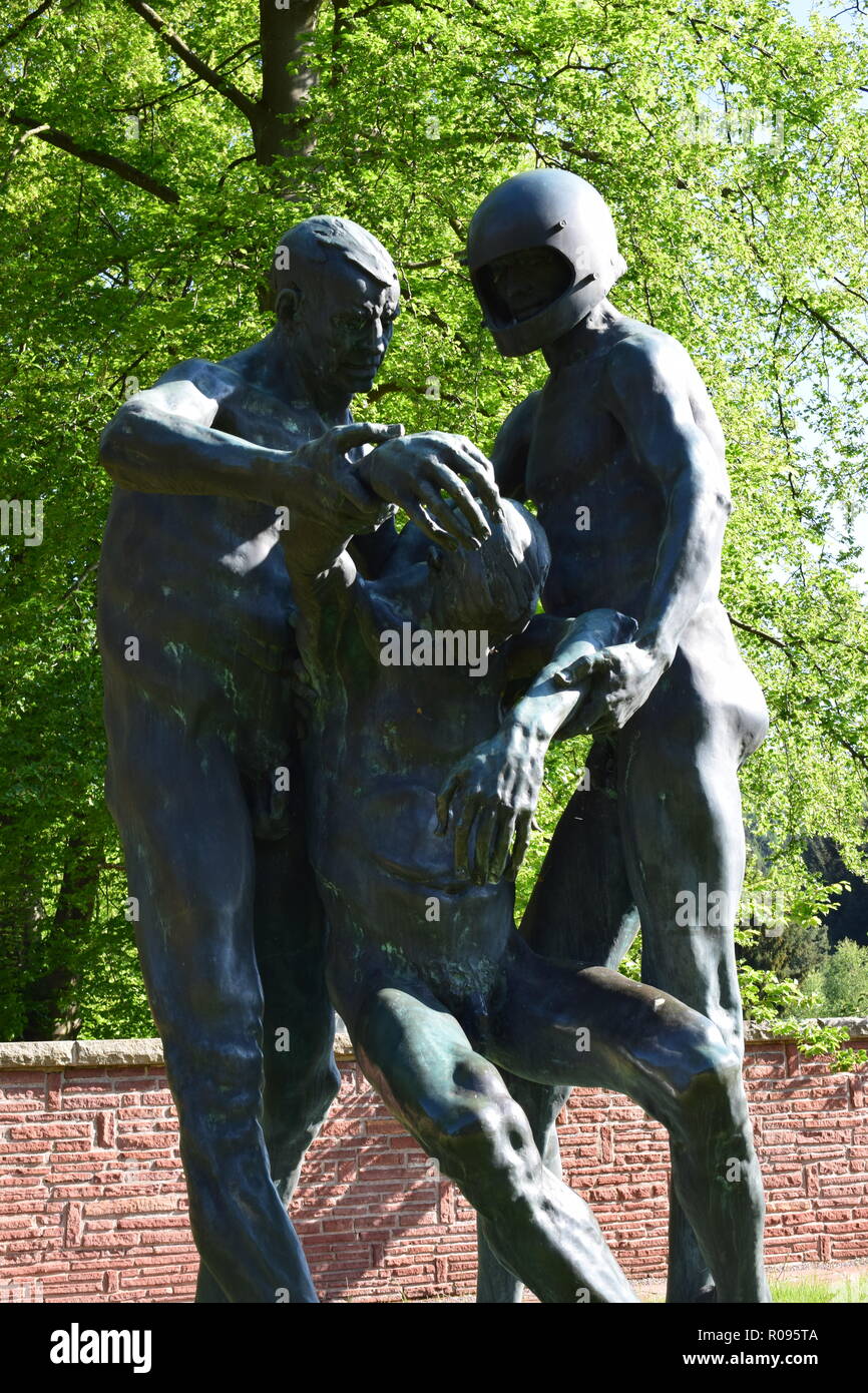 A bronze statue in the War War 2 military Cemetery in Reimsbach depicts ...