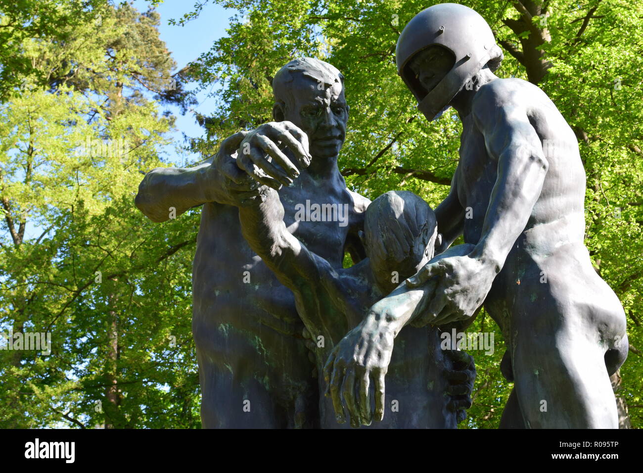 A bronze statue in the War War 2 military Cemetery in Reimsbach depicts ...