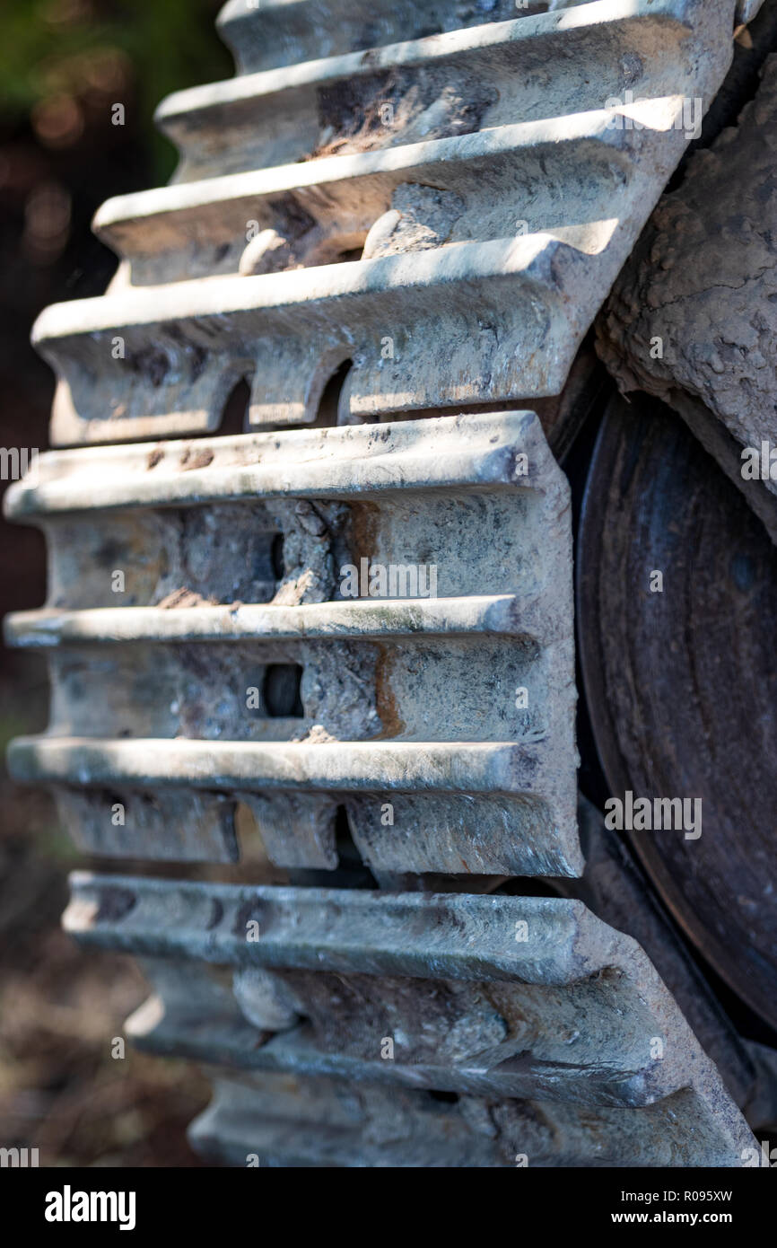Industrial implement steel metal wheel tracks on dirt Stock Photo - Alamy
