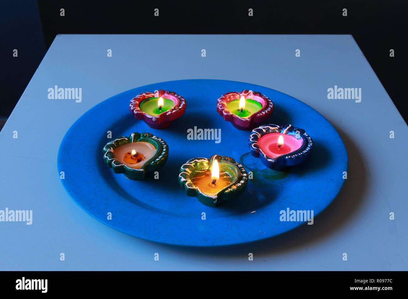 5 Diyas arranged in a plate,placed on table for the celebration of ...
