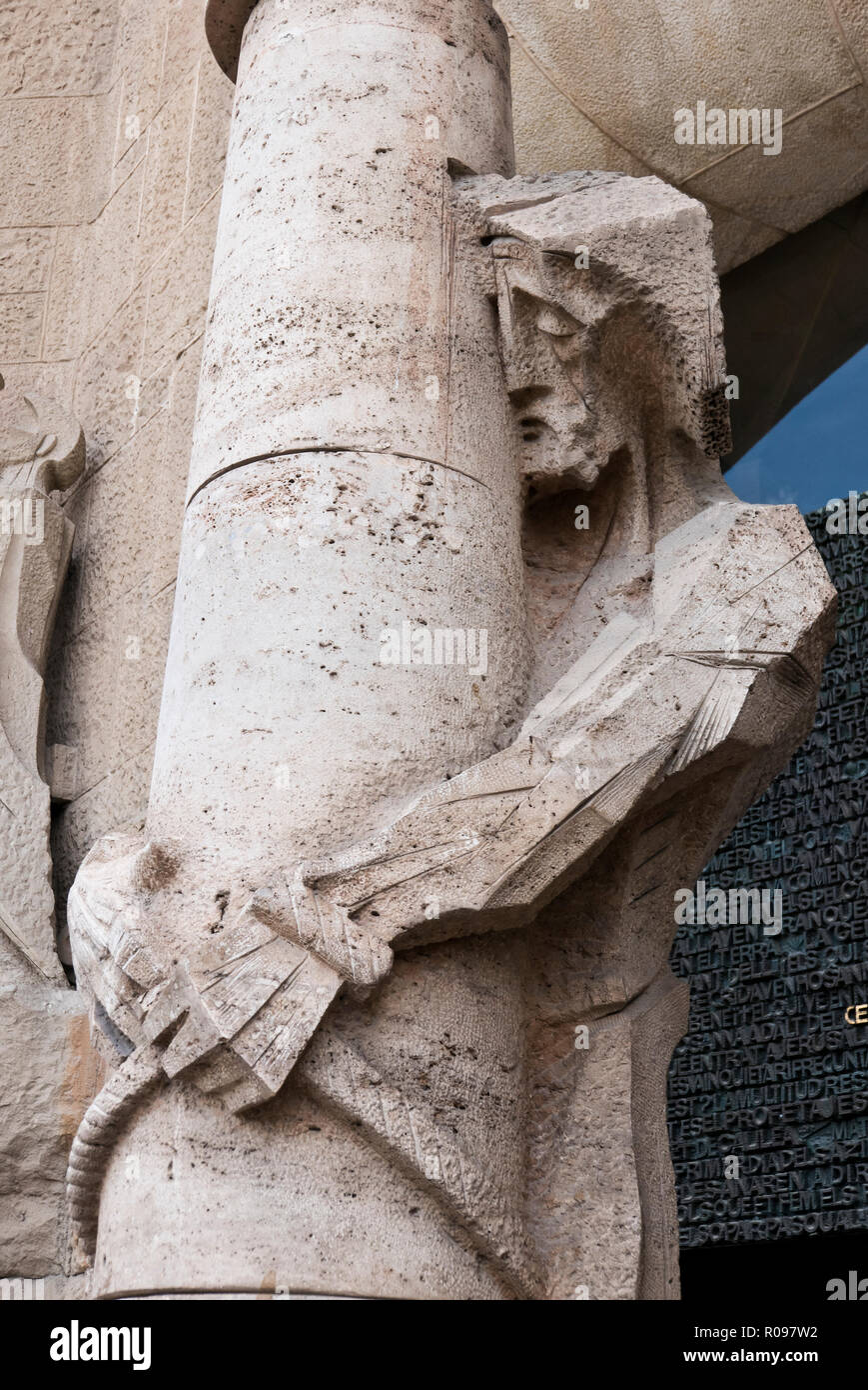 A sculpture of Jesus tied to a column outside the Sagrada Familia ...