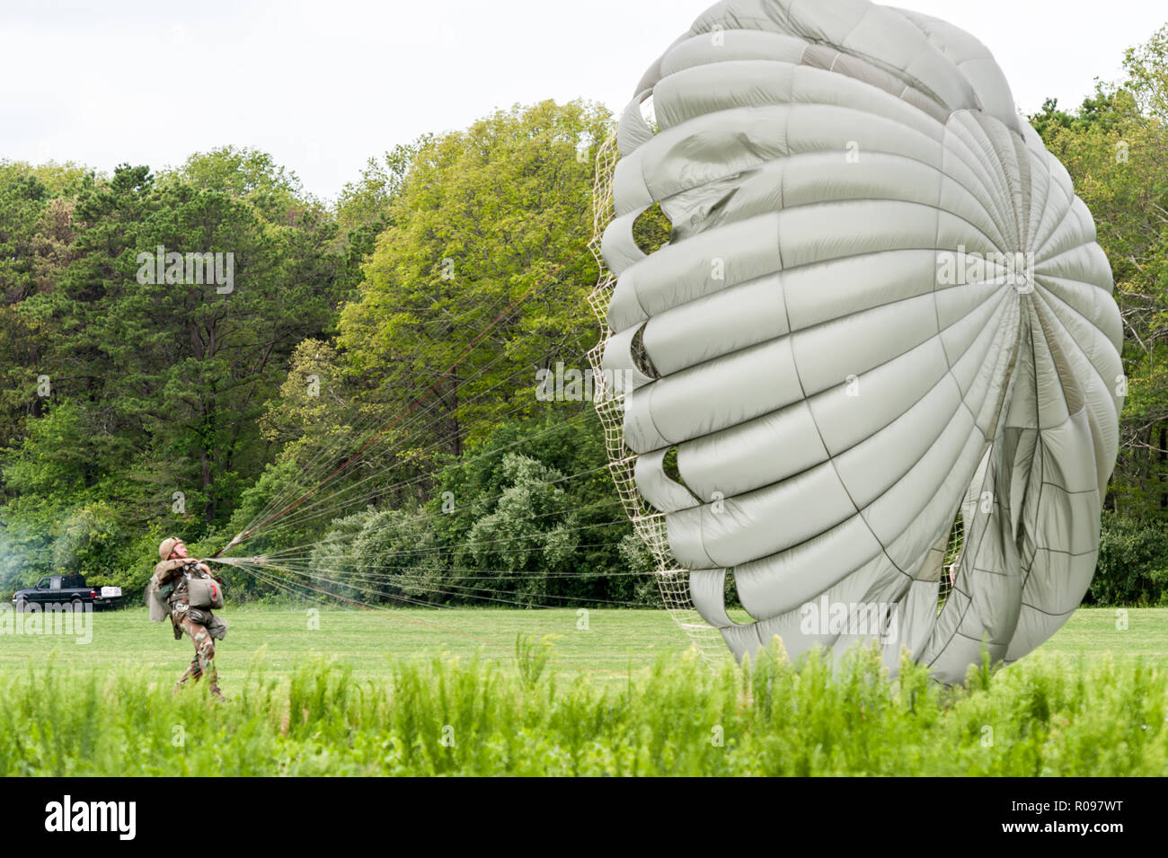 Soldier running to the dropzone at 2016 Leapfest, international static ...