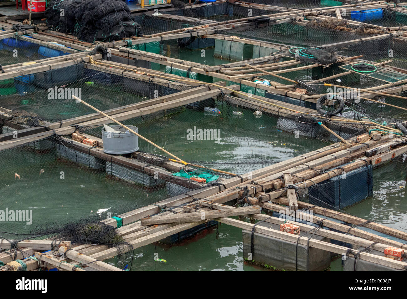 floating fish farm in ha long bay vietnam Stock Photo - Alamy