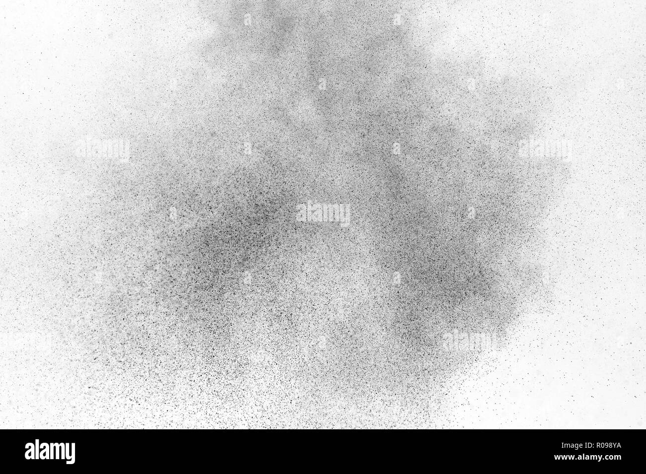 Black particles explosion isolated on white background. Abstract dust ...
