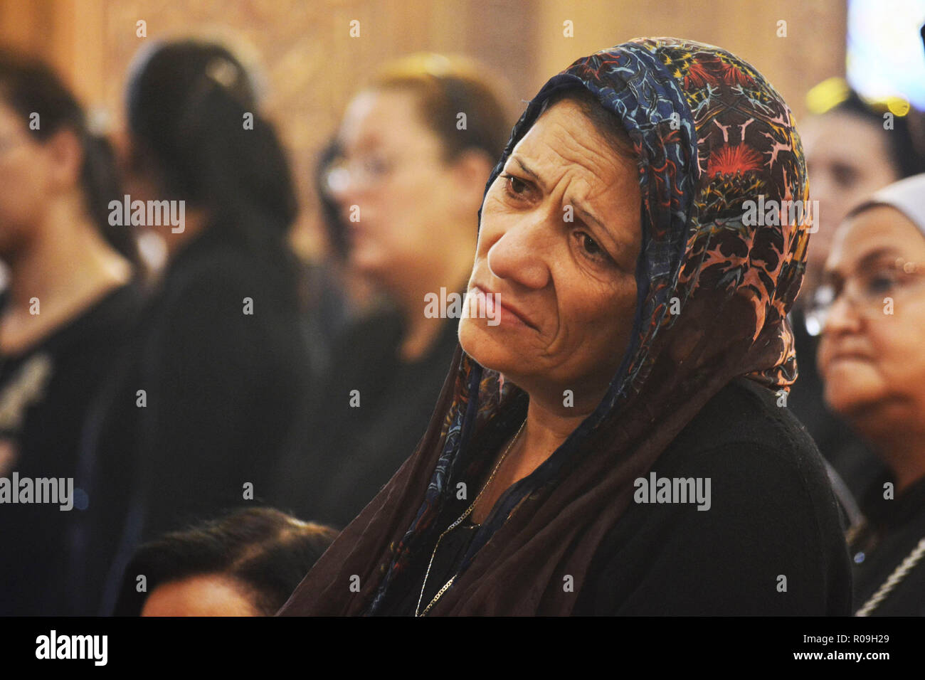 Al Minya, Egypt. 03rd Nov, 2018. A woman attends a funeral service at ...