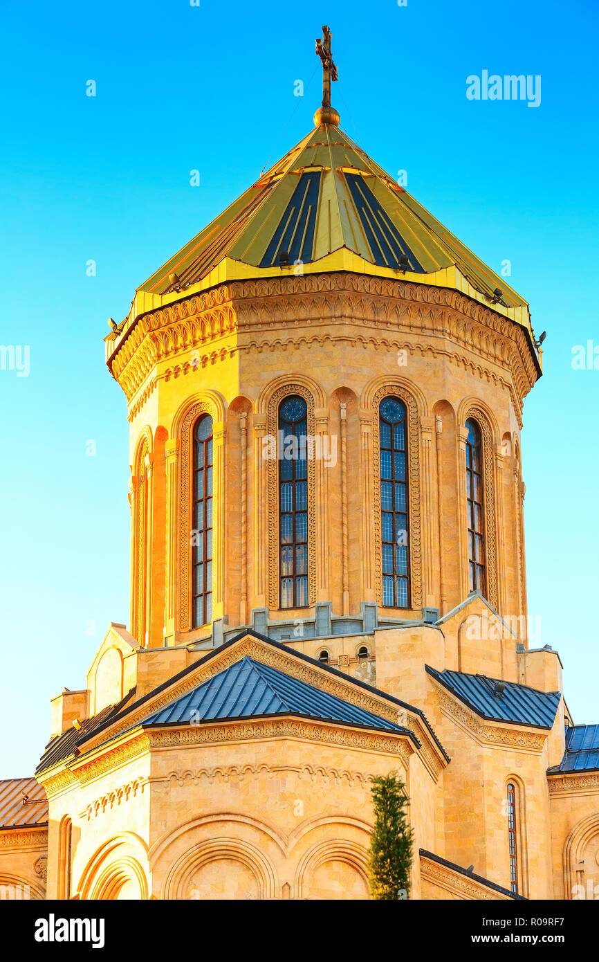 Holy Trinity church or Tsminda Sameba Cathedral closeup sunset vertical ...