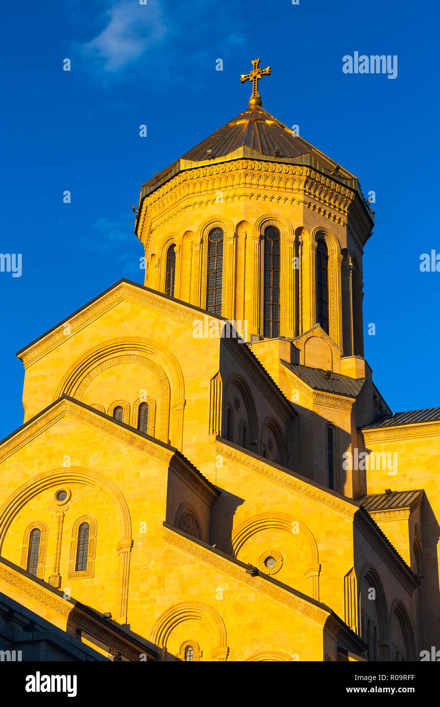 Holy Trinity church or Tsminda Sameba Cathedral closeup sunset vertical ...