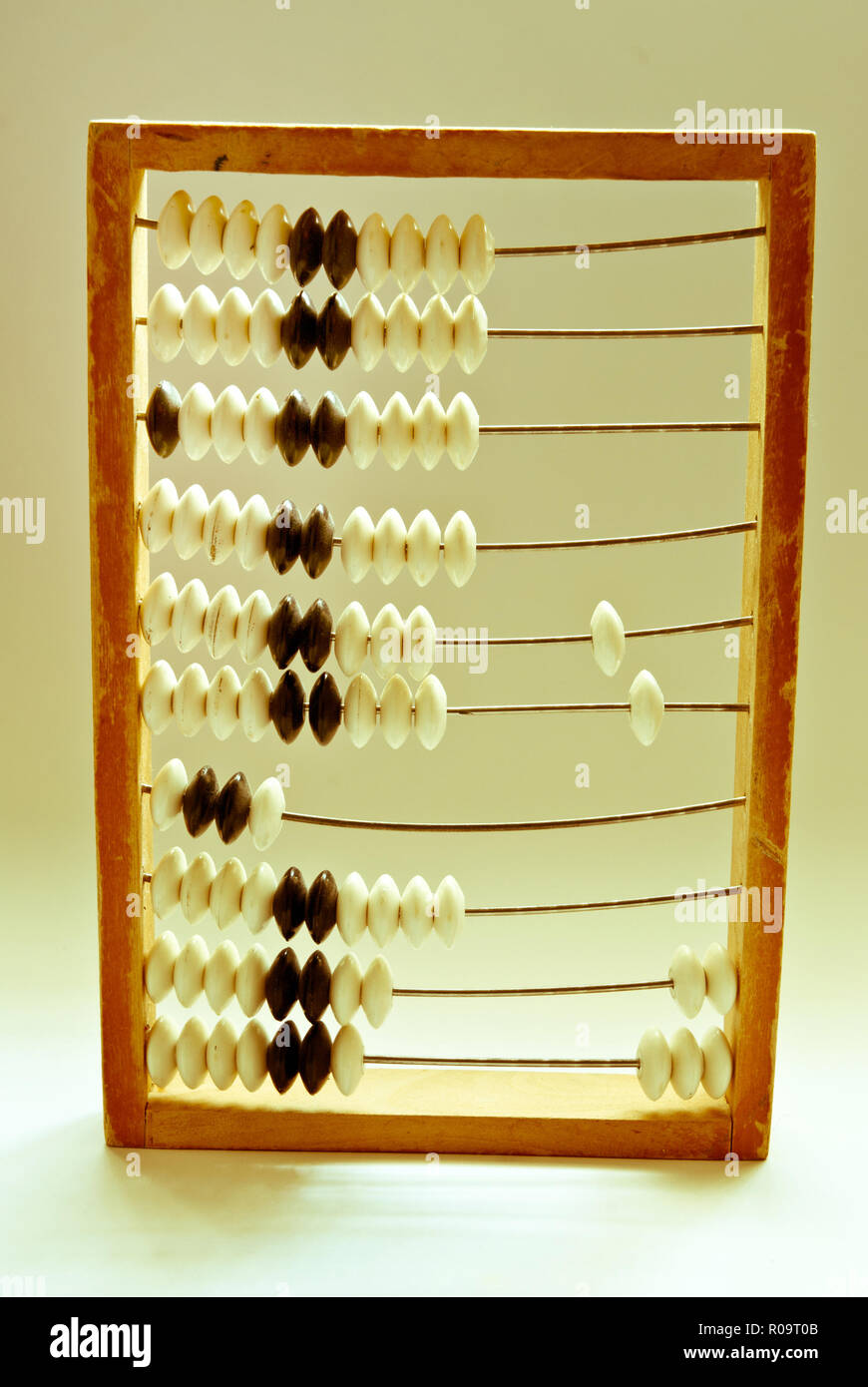 old abacus on a yellow background Stock Photo - Alamy