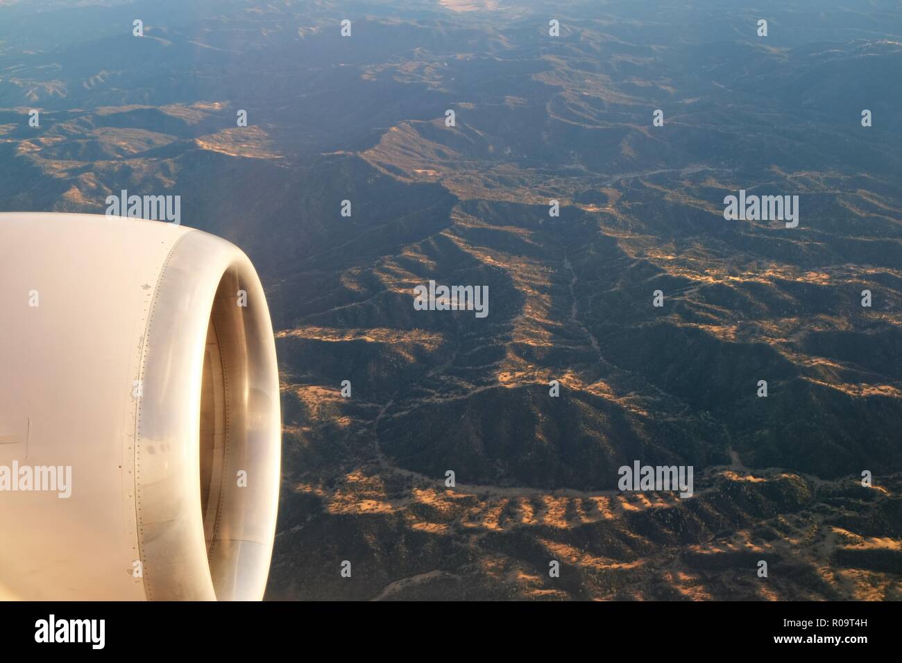 View from an airplane window; Northern California landscape and turbine ...