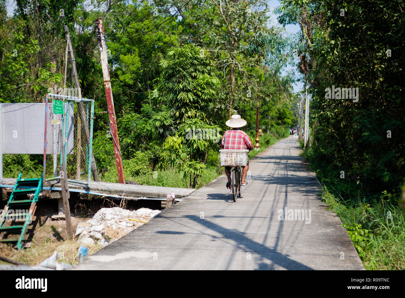 Man local bridge road on Koh Kret island on Menam river in Bangkok ...