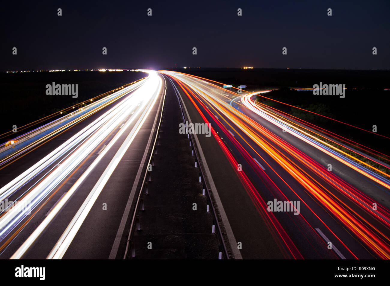 Highway car light trails scene Stock Photo - Alamy