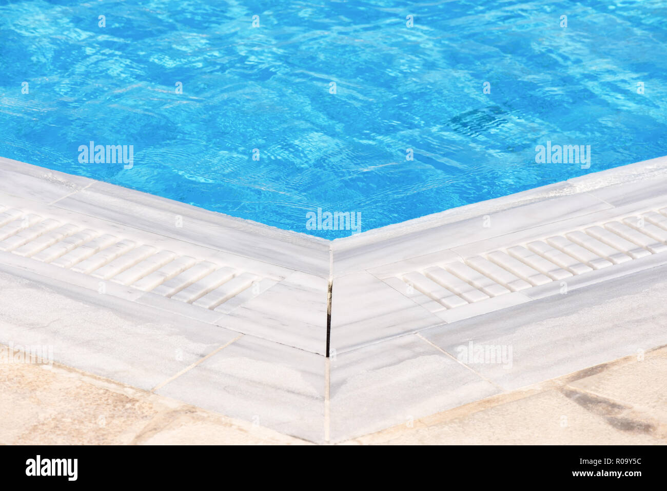 Swimming pool detail with clear blue water Stock Photo - Alamy