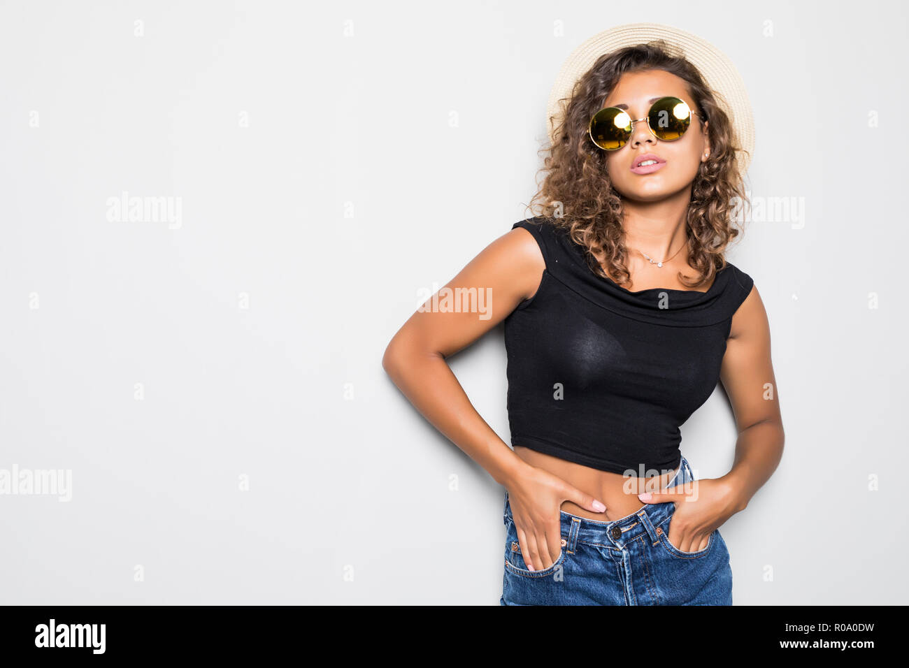Portrait of attractive mulatto woman in sunglasses isolated on white ...