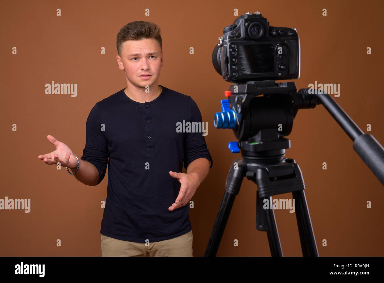 Young man explaining arms hi-res stock photography and images - Alamy