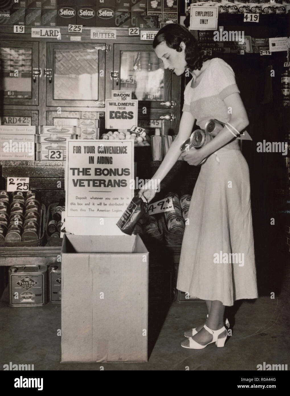 Miss Mary Wick Placing Bag of Coffee in Food Box placed in Stores to ...