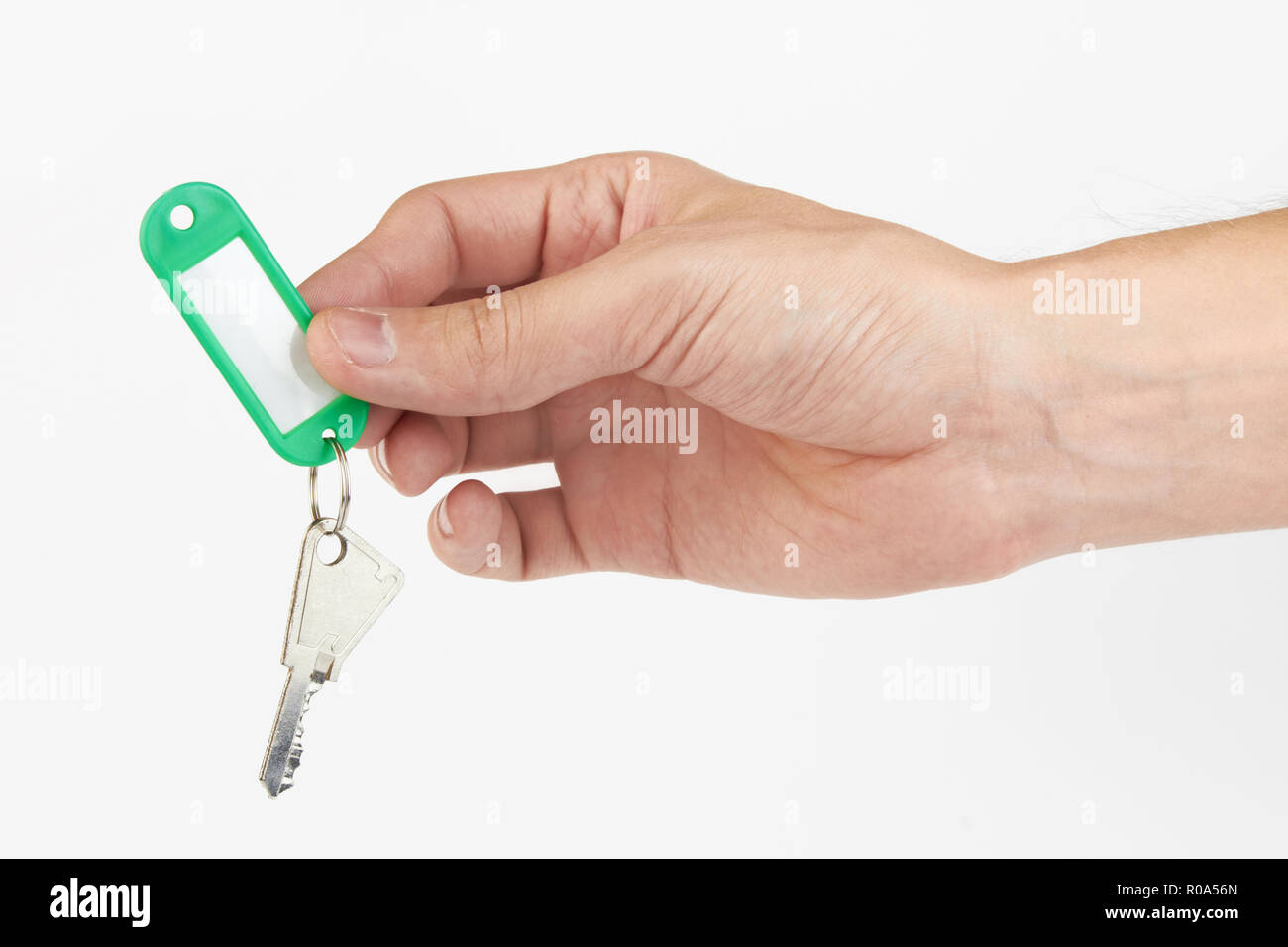 Key in hand. Element of design Stock Photo - Alamy