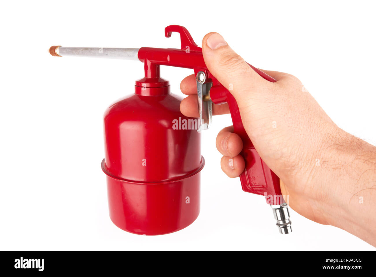 Spray gun in hand isolated over a white background Stock Photo - Alamy