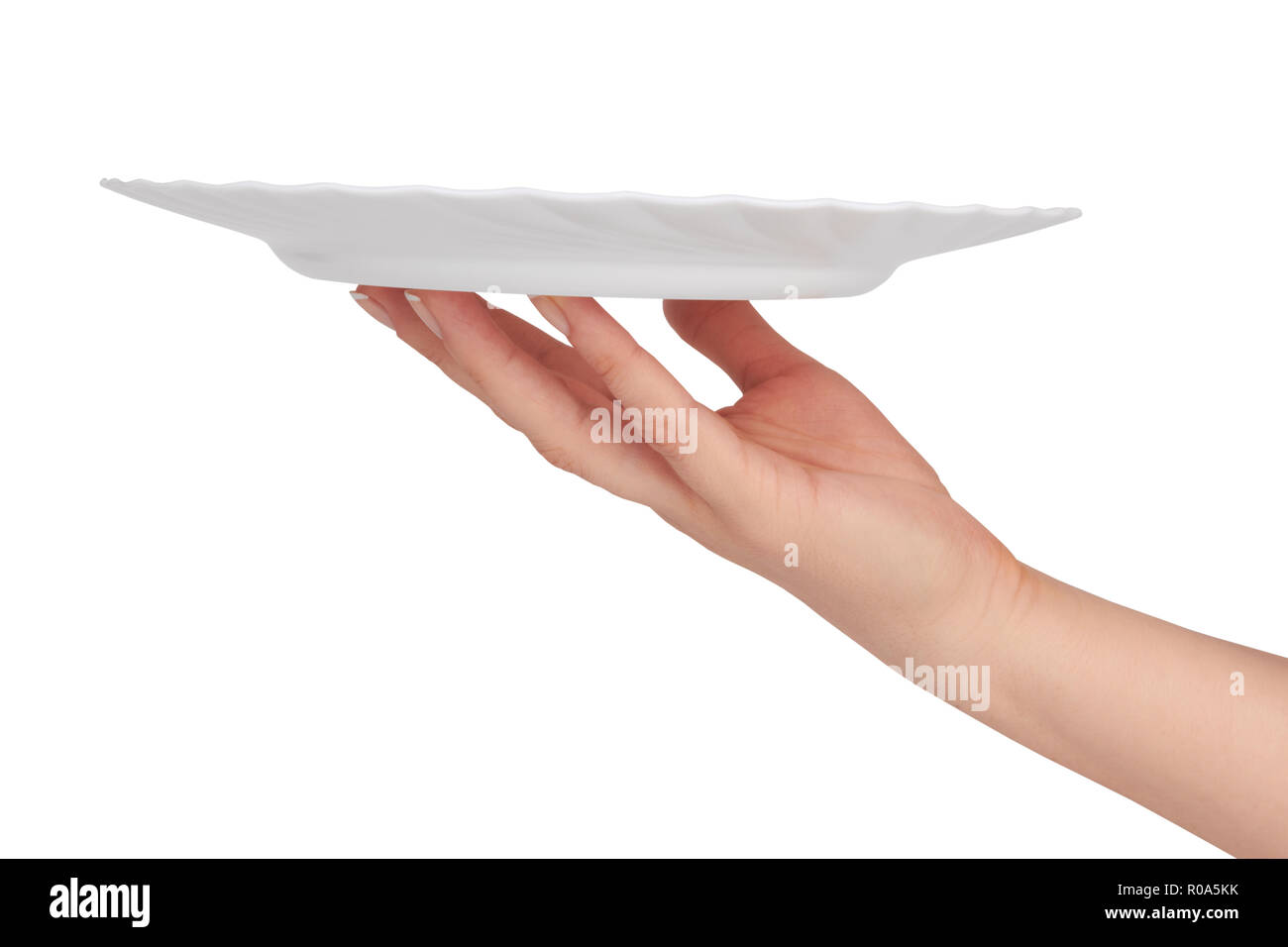 white kitchen plate on woman hand on white background Stock Photo - Alamy