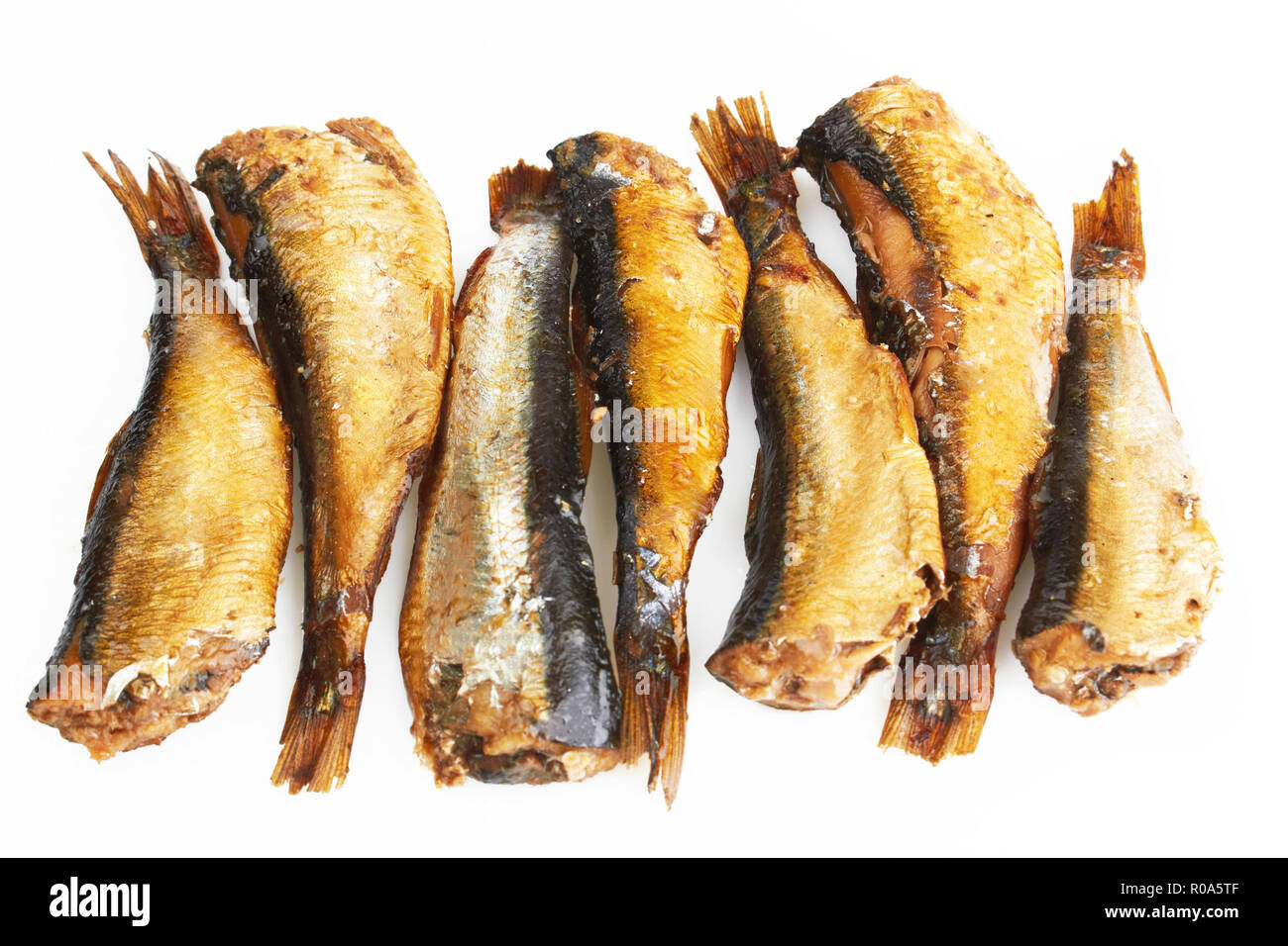 Smoked sprats in oil on white background Stock Photo - Alamy