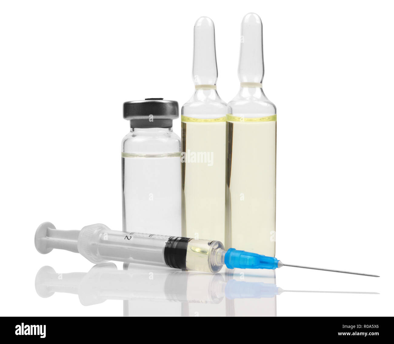 Ampules and syringe isolated on white background Stock Photo - Alamy