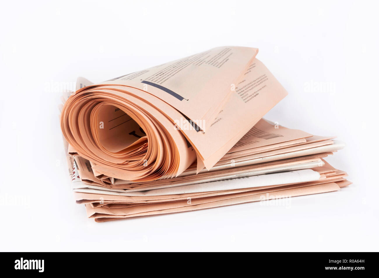 Roll of newspapers, on a white background Stock Photo - Alamy