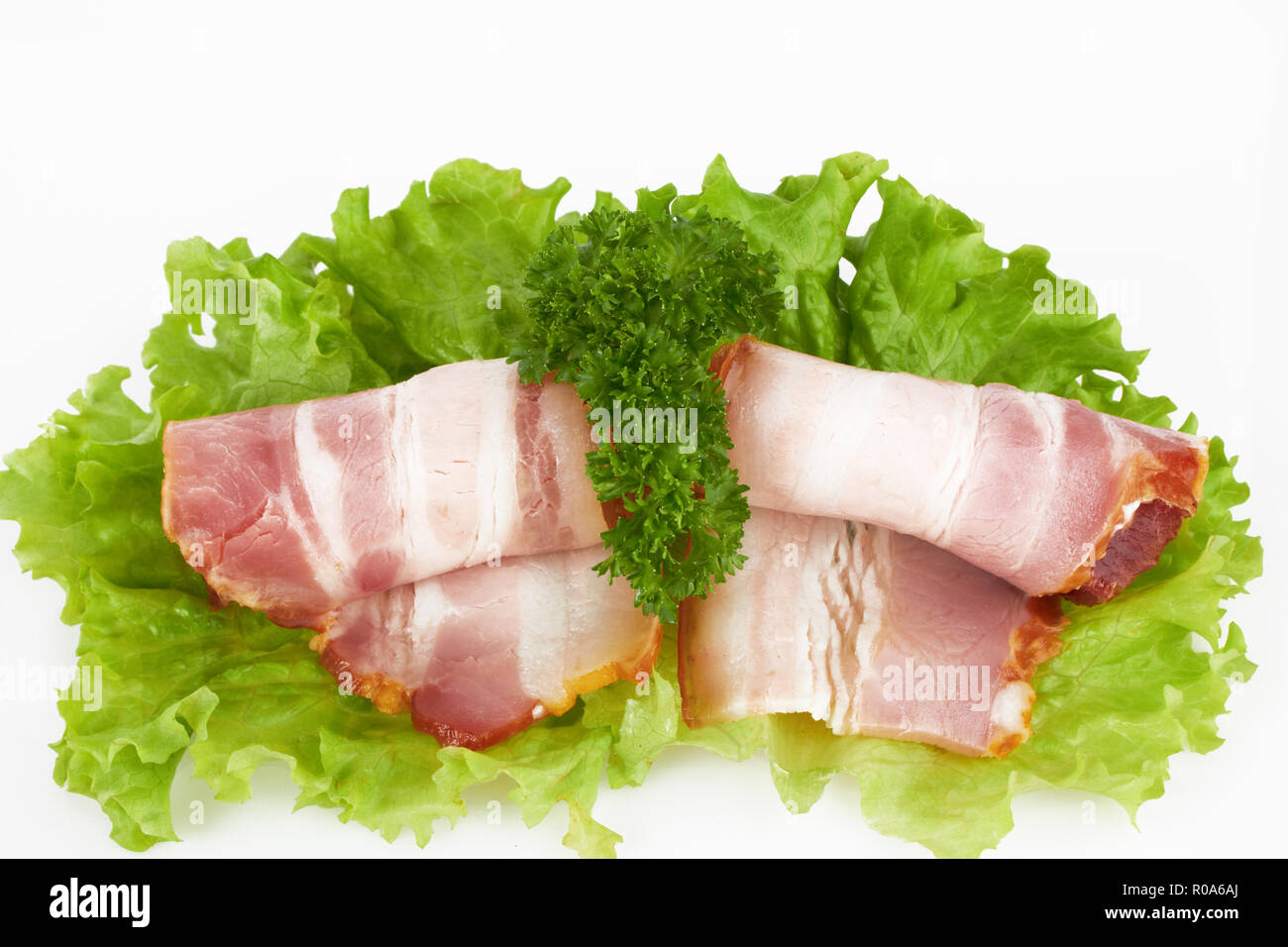sliced bacon on white background Stock Photo - Alamy
