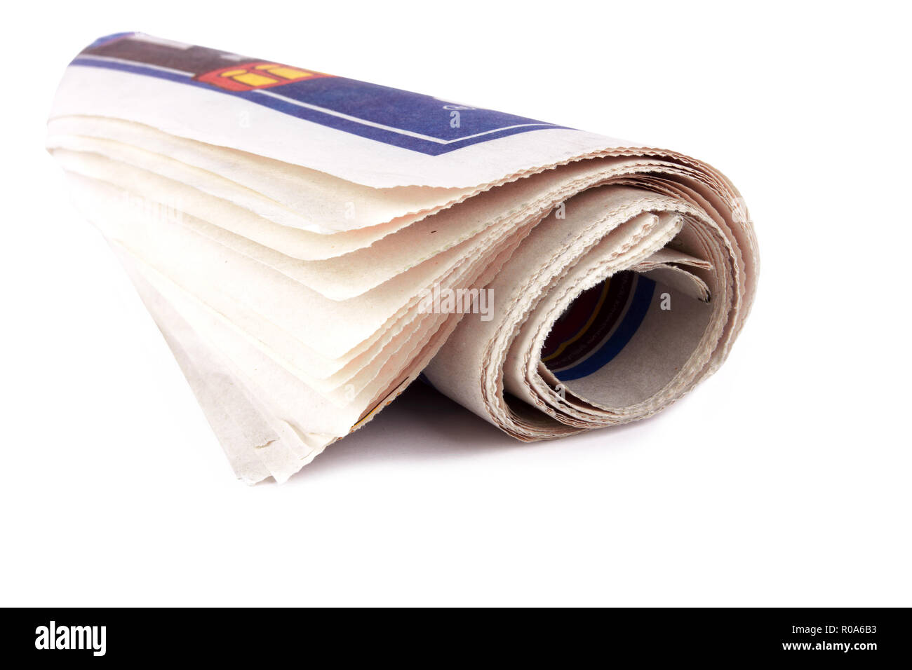 Roll of newspaper isolated on white background Stock Photo - Alamy