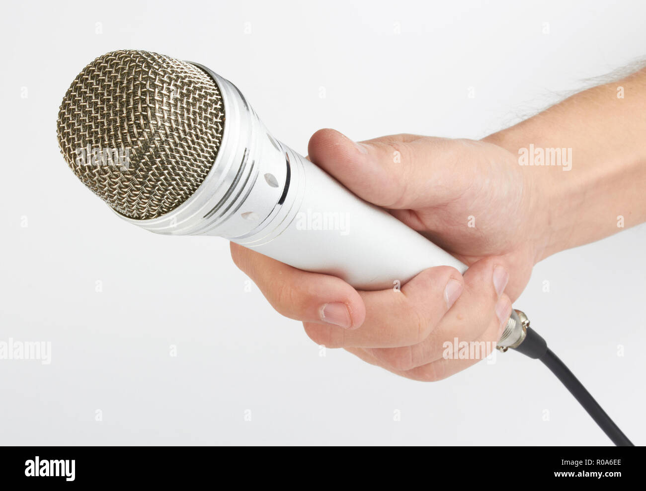 hand with a microphone on white Stock Photo - Alamy