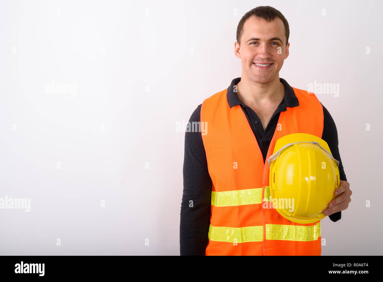 Portrait of young man construction worker standing Stock Photo - Alamy