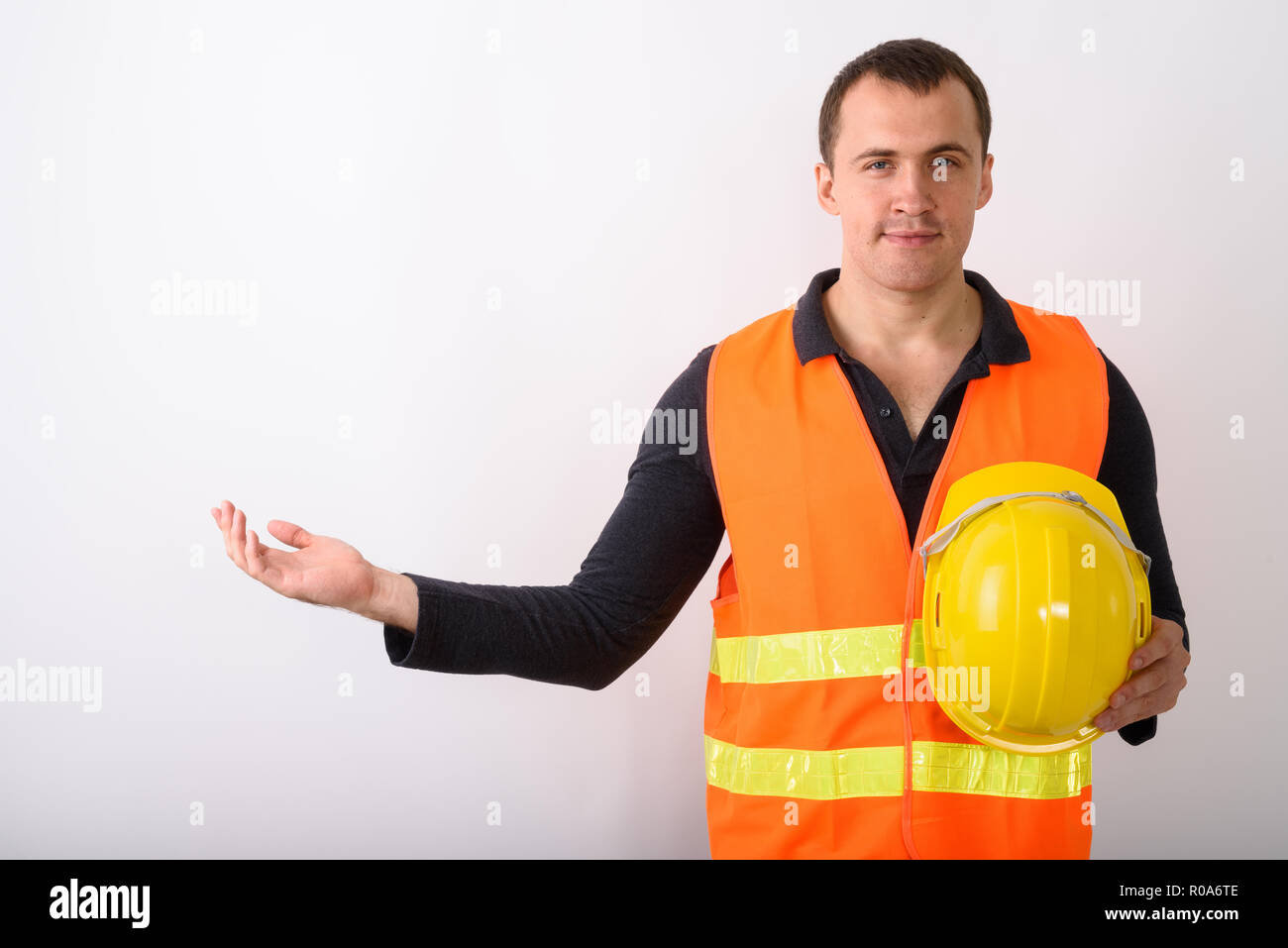 Portrait of young man construction worker standing Stock Photo - Alamy