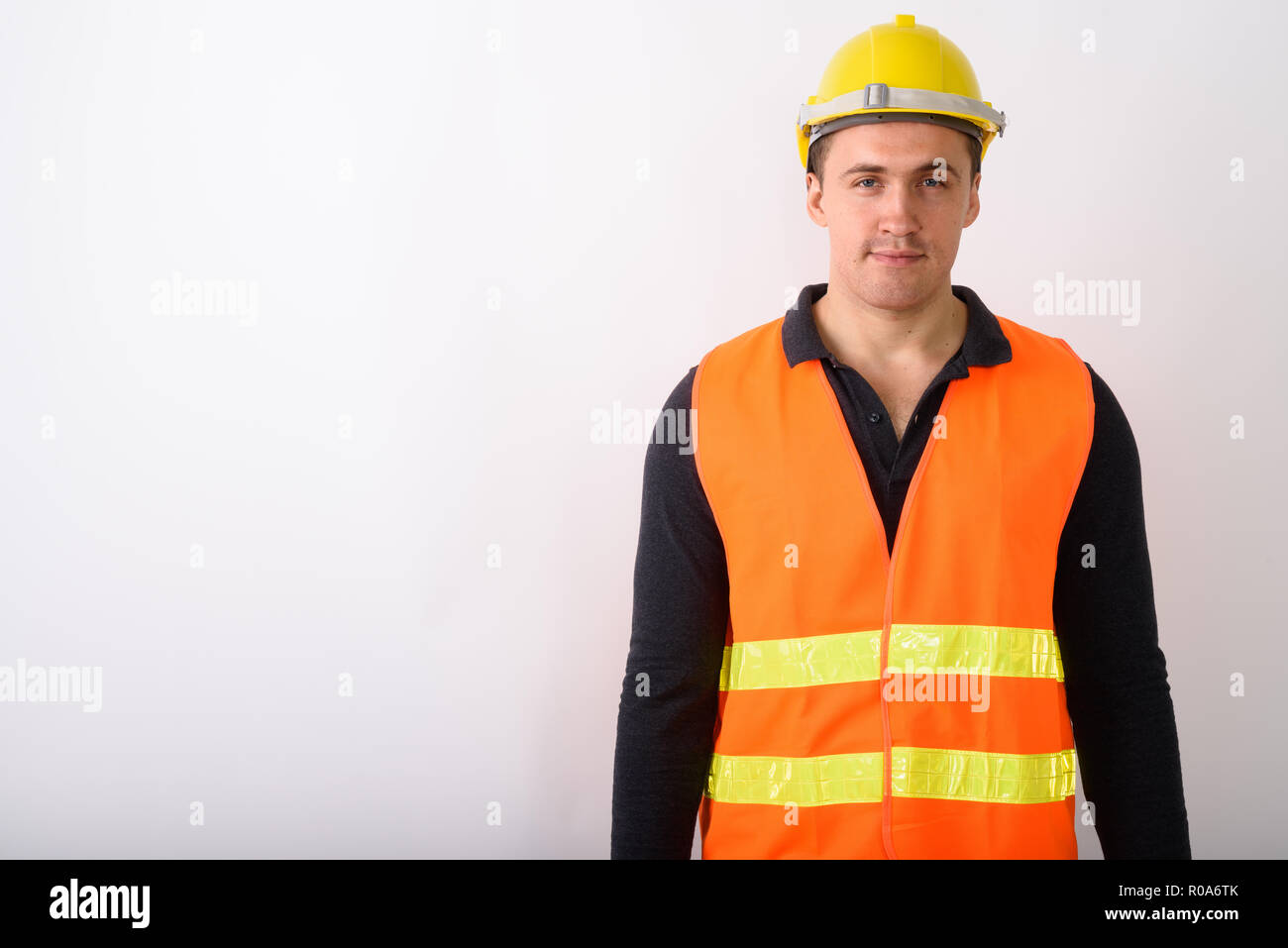 Portrait of young man construction worker standing Stock Photo - Alamy