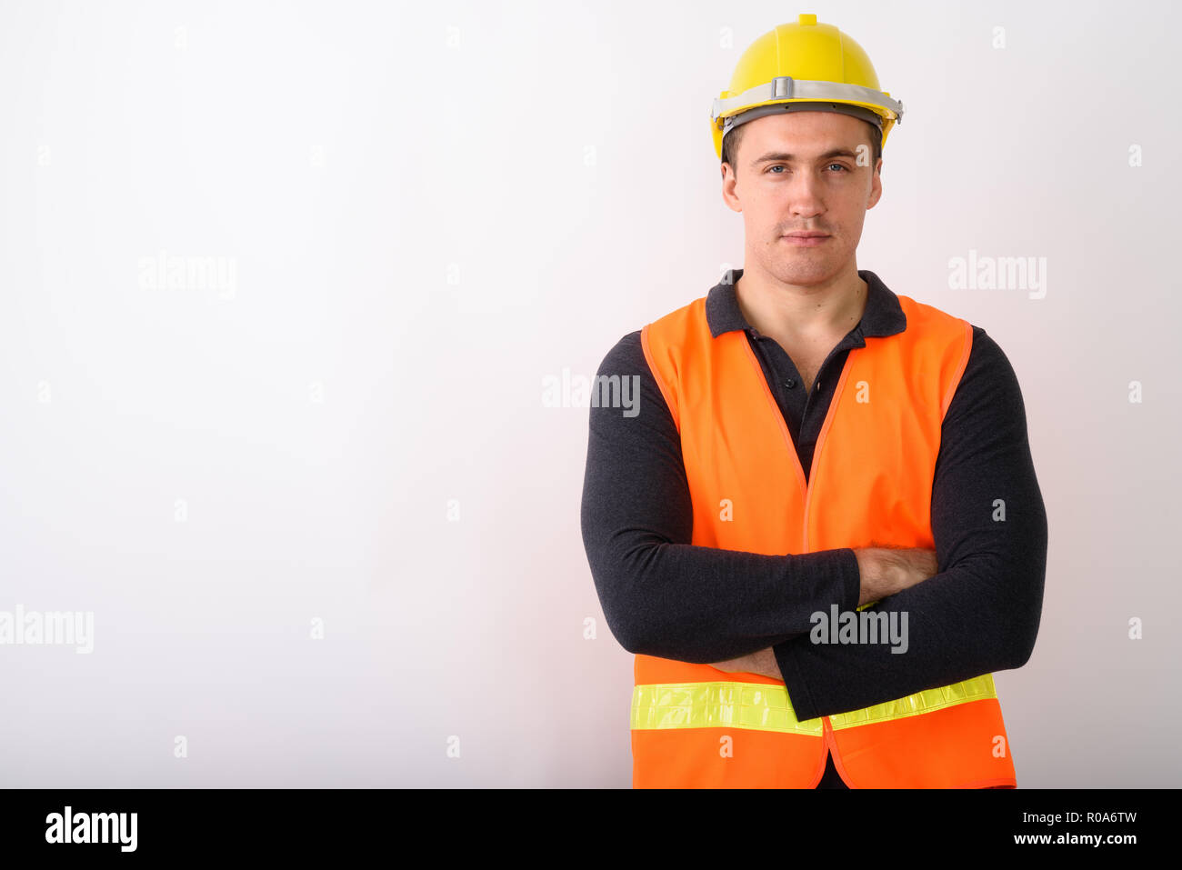 Portrait of young man construction worker standing Stock Photo - Alamy